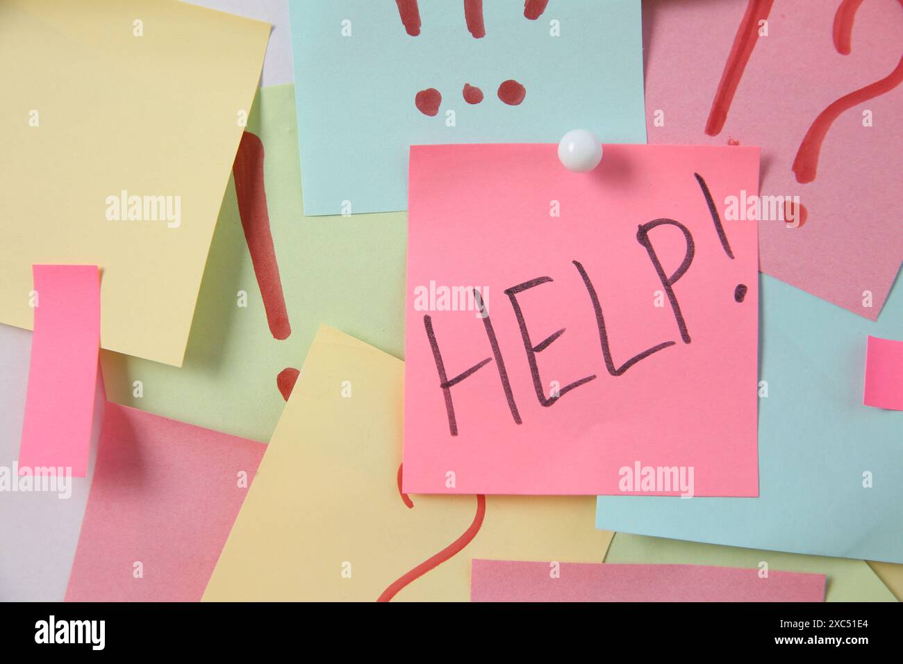 Notes with word Help and symbols on board, closeup Stock Photo - Alamy