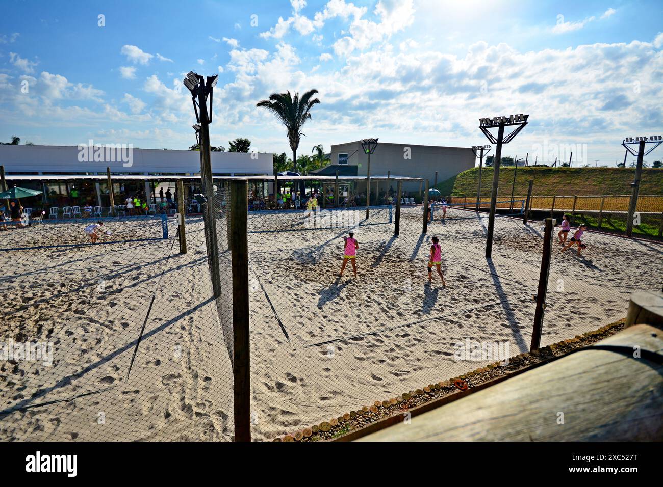 Athletes playing in beach tennis competition Stock Photo - Alamy