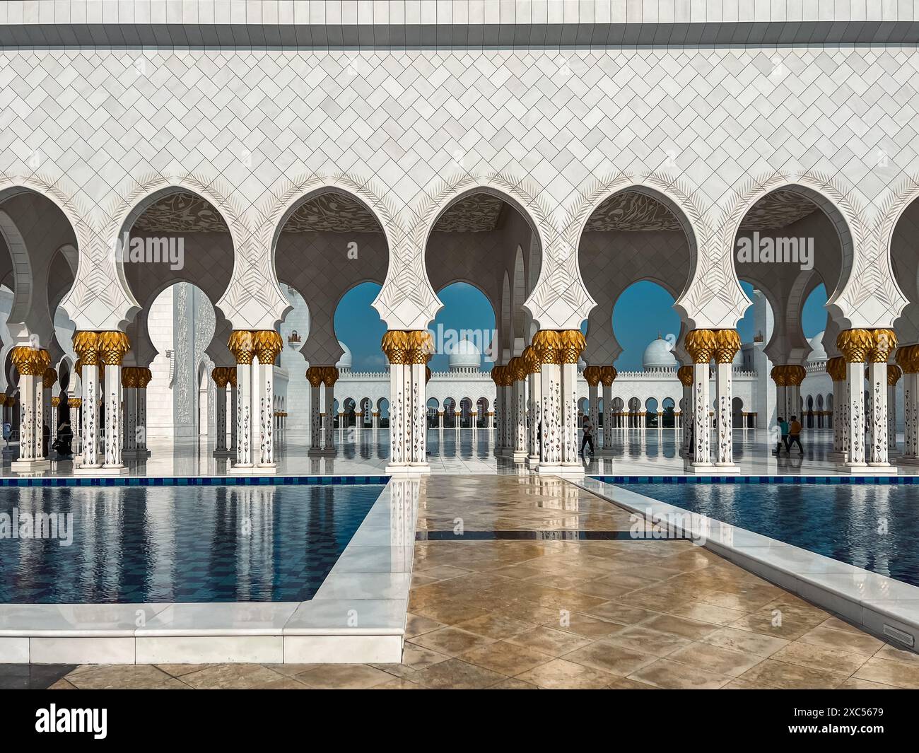 Abu Dhabi, UAE - January 4, 2024: The tranquil colonnade and reflective ...