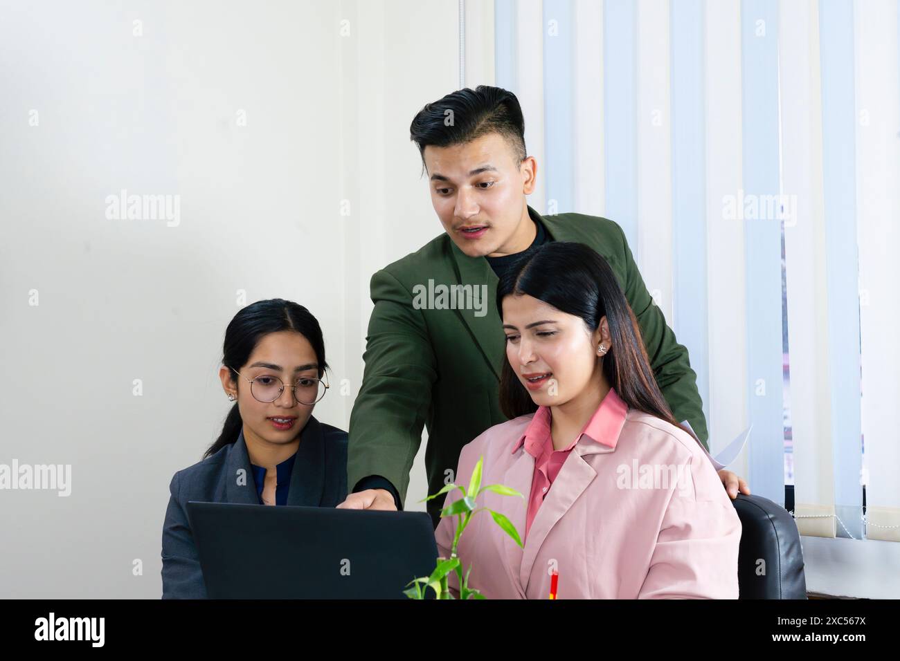 Young Office Team Members in a Business Meeting Room discussing and ...