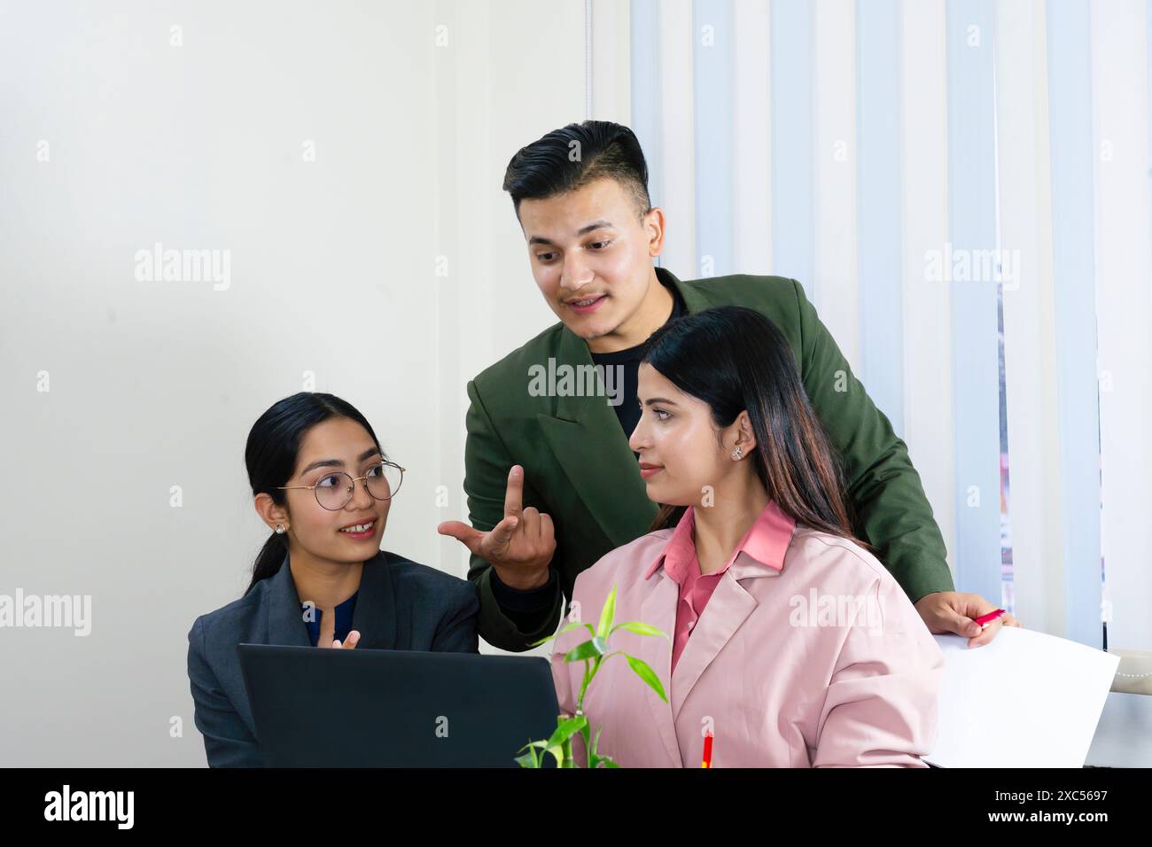 Young Office Team Members in a Business Meeting Room discussing and ...