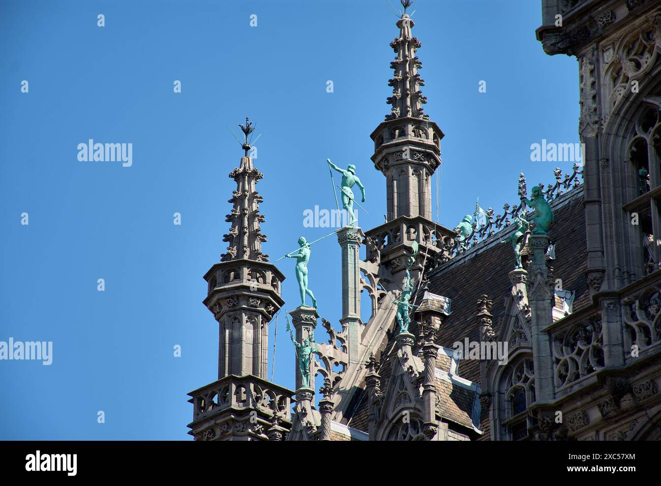 Statues on the roof of the Gothic Revival style Maison du Roi ...