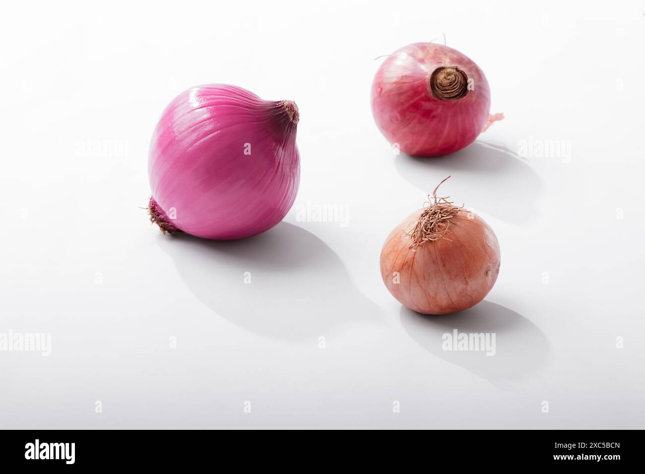 Organic Onions On A Plain White Background Stock Photo - Alamy