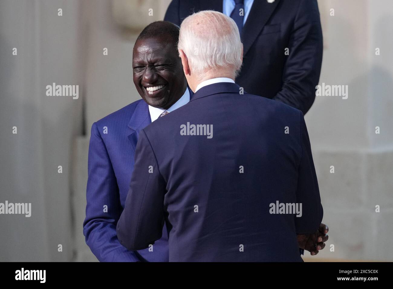 President of Kenya, William Ruto and US President Joe Biden chat whilst ...