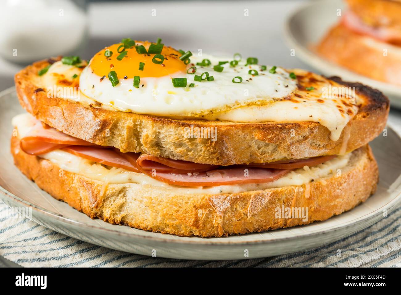 French Croque Madame Sandwich with Ham and Egg Stock Photo - Alamy