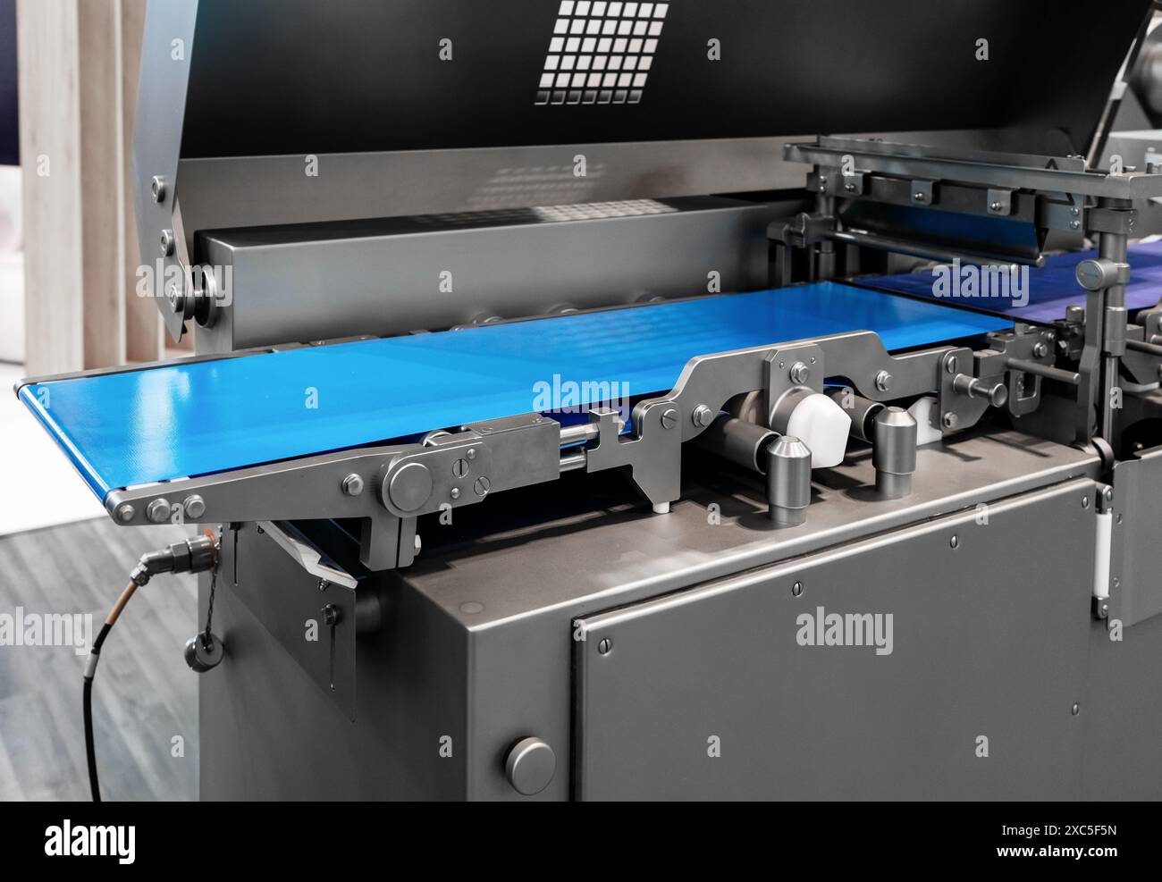 Automated sealing machine and packaging line Stock Photo - Alamy