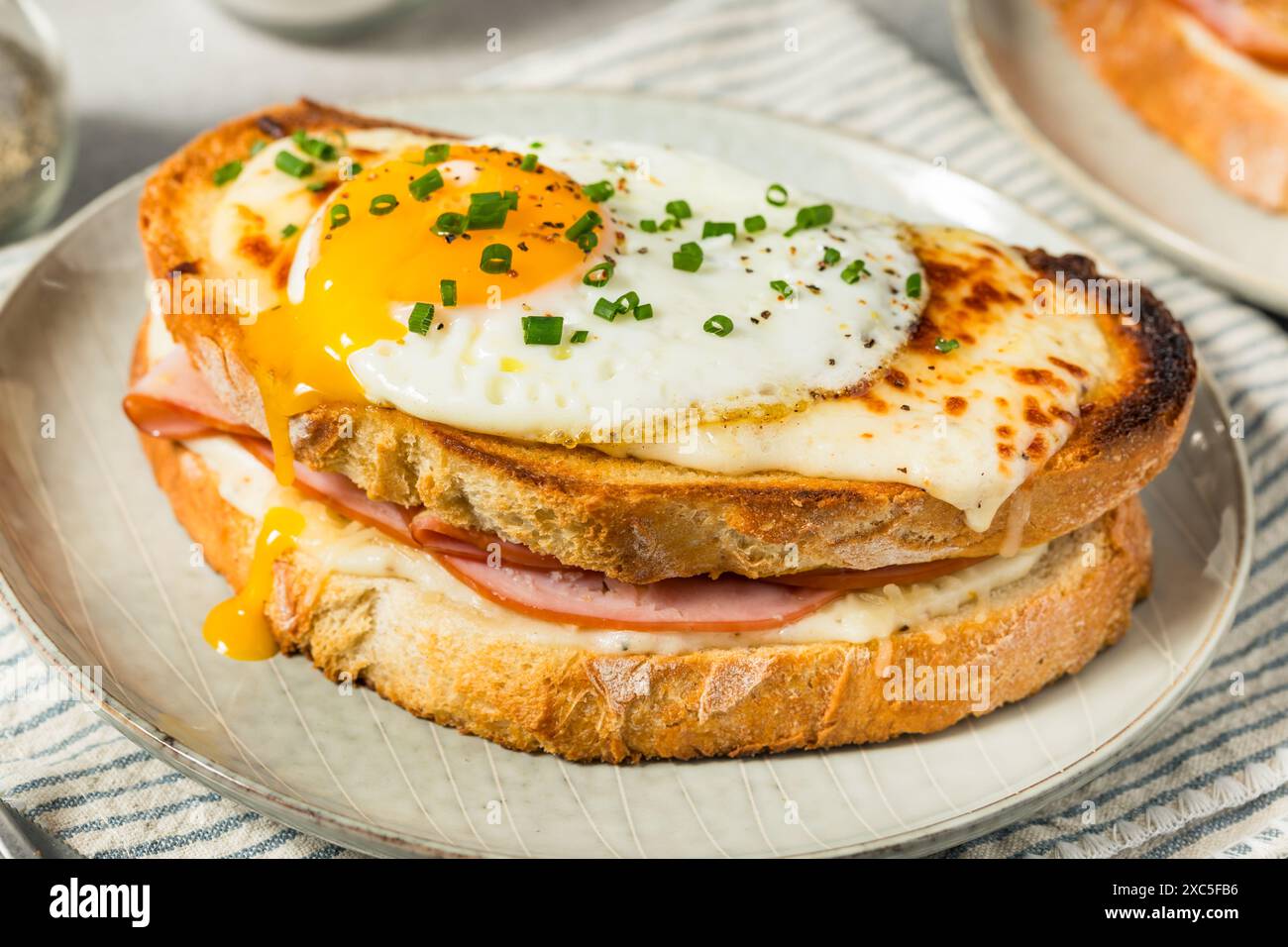 French Croque Madame Sandwich with Ham and Egg Stock Photo - Alamy