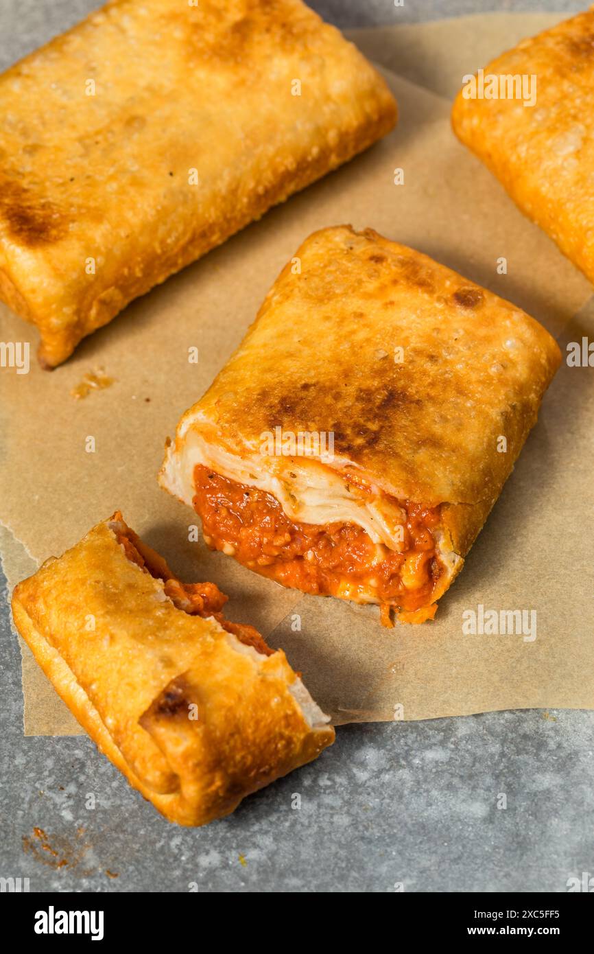 Chicago Style Pizza Puff Pocket with Sauce and Cheese Stock Photo - Alamy