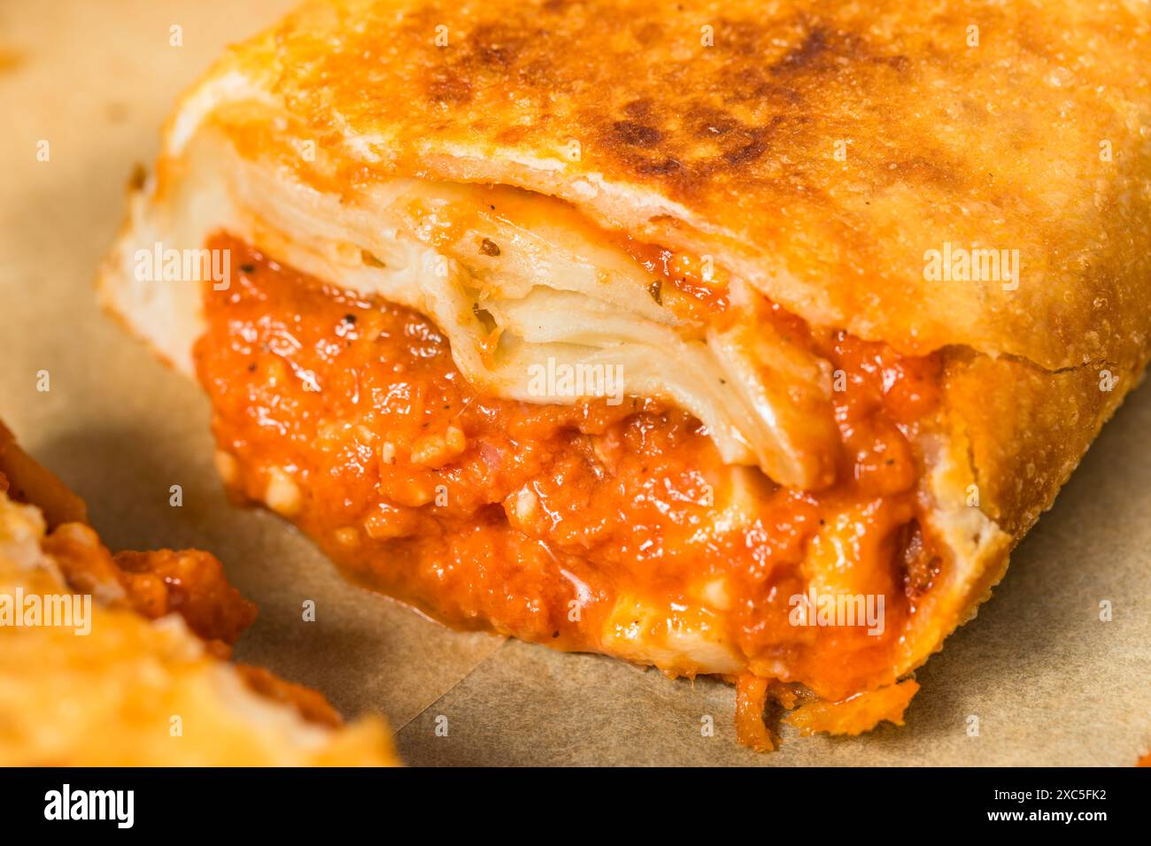 Chicago Style Pizza Puff Pocket with Sauce and Cheese Stock Photo - Alamy