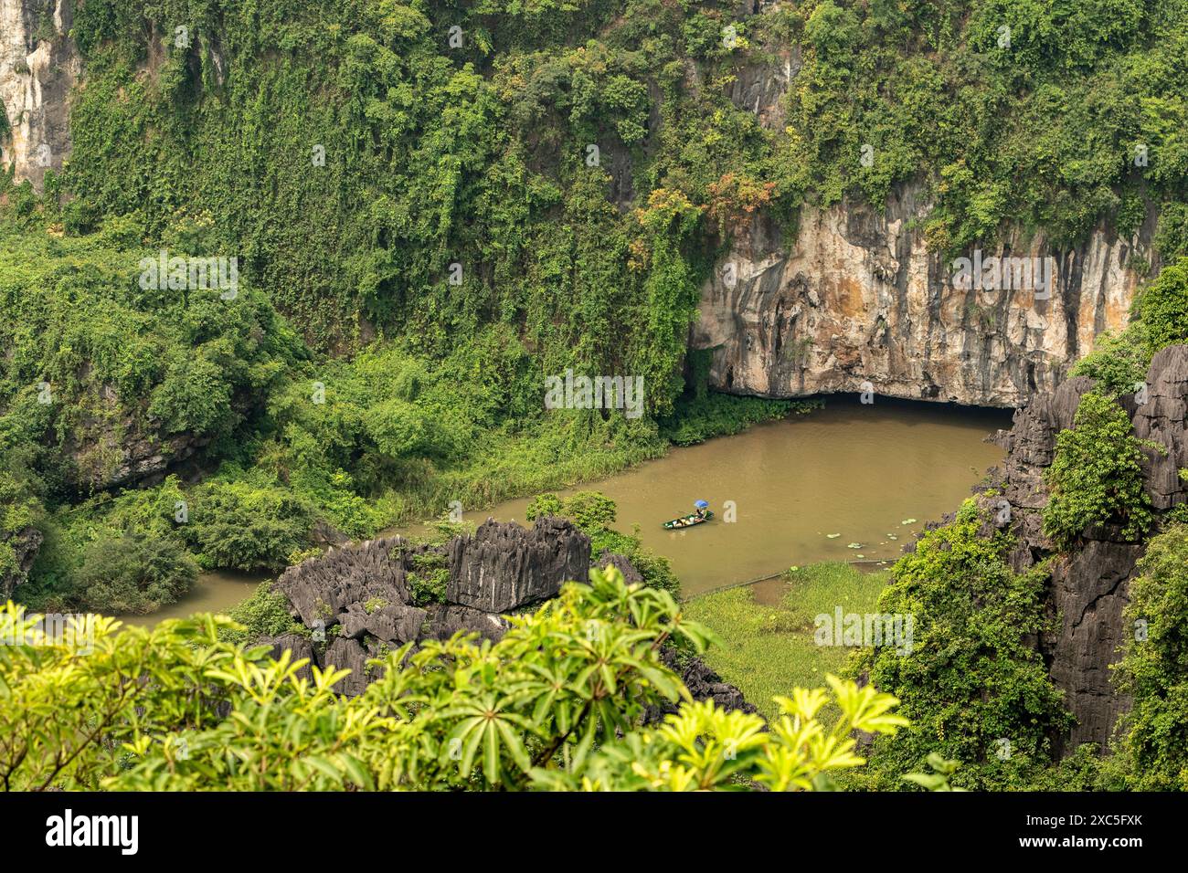 Breathtaking view of tourist sampans meandering along the Tam Coc river, taken from the ...