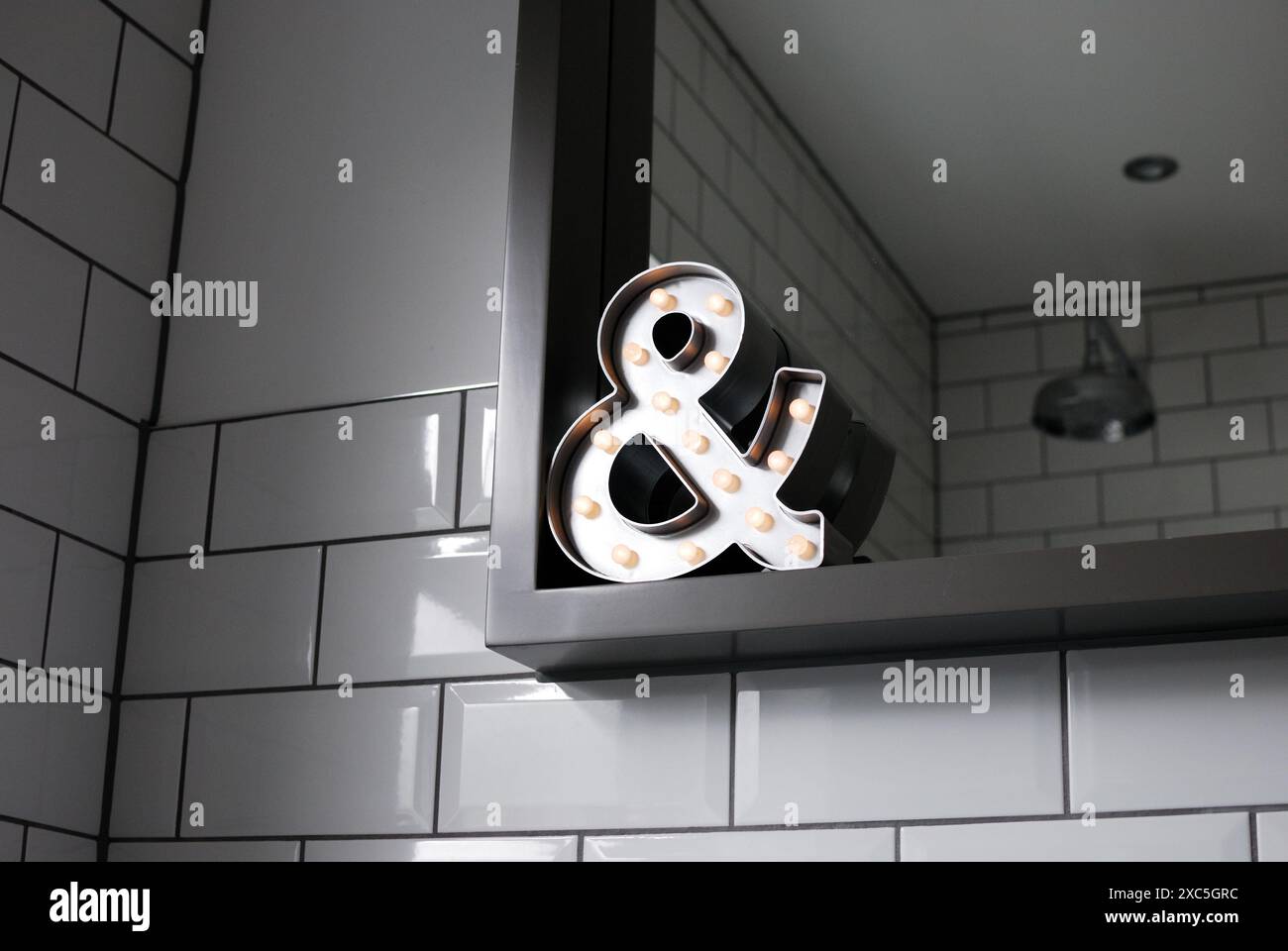 Ampersand symbol in bathroom Stock Photo - Alamy