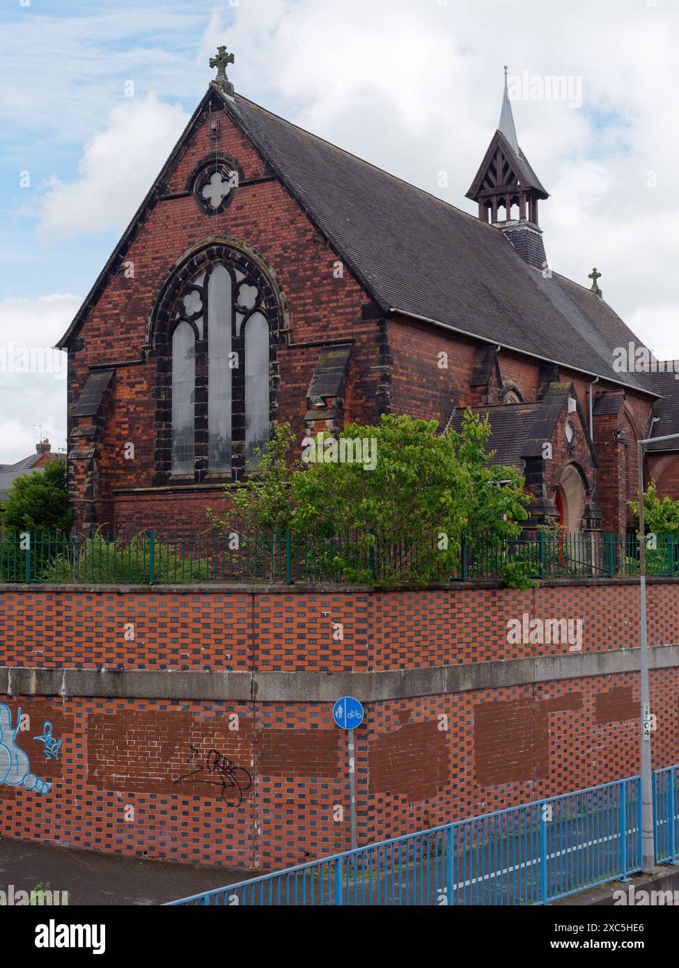 Church beside a pedestrian walkway near Meir in Stoke on Trent, Staffs ...