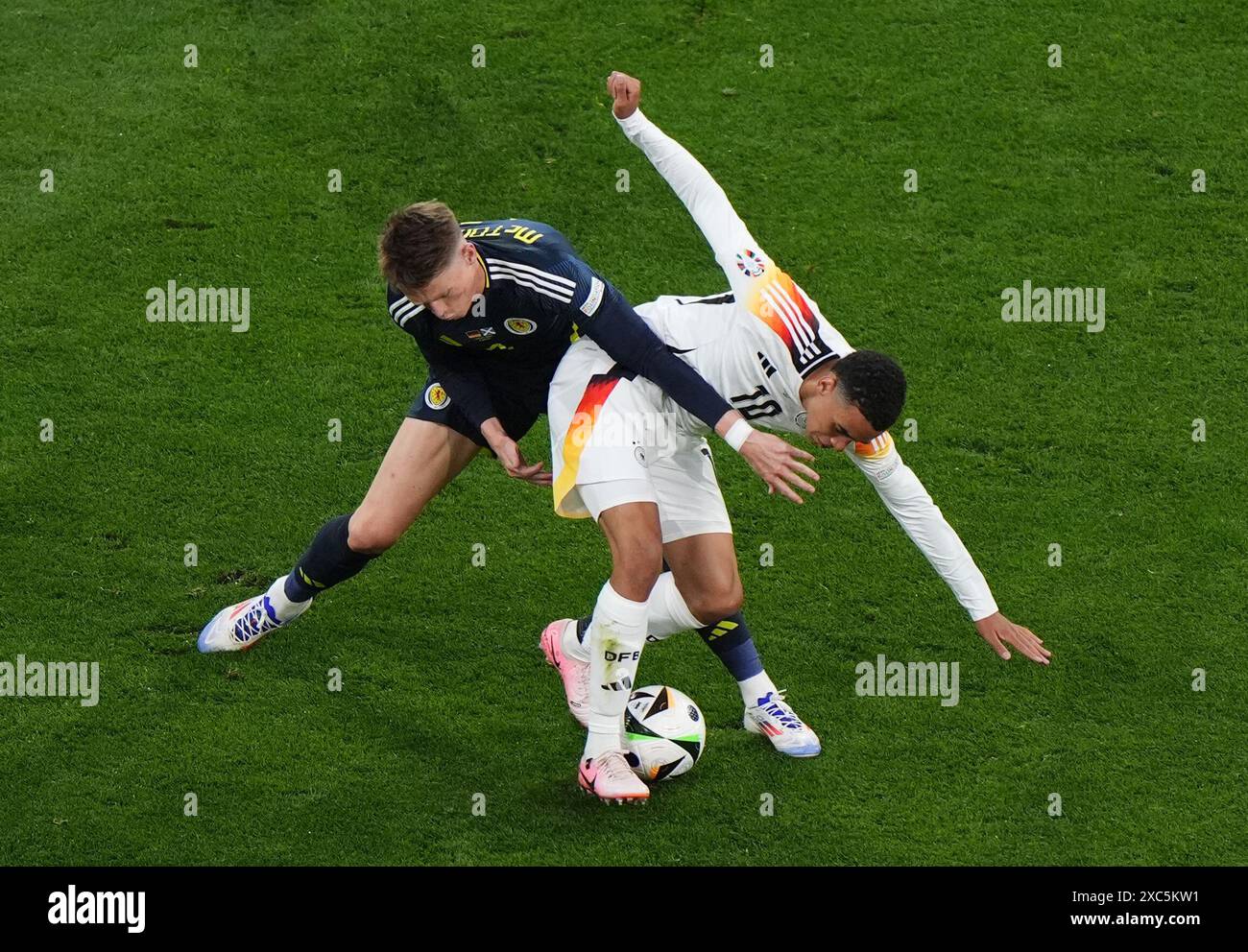 Scotland's Scott McTominay (left) and Germany's Jamal Musiala battle ...