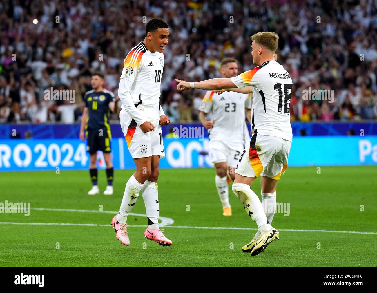 Germany's Jamal Musiala (left) celebrates scoring their side's second ...