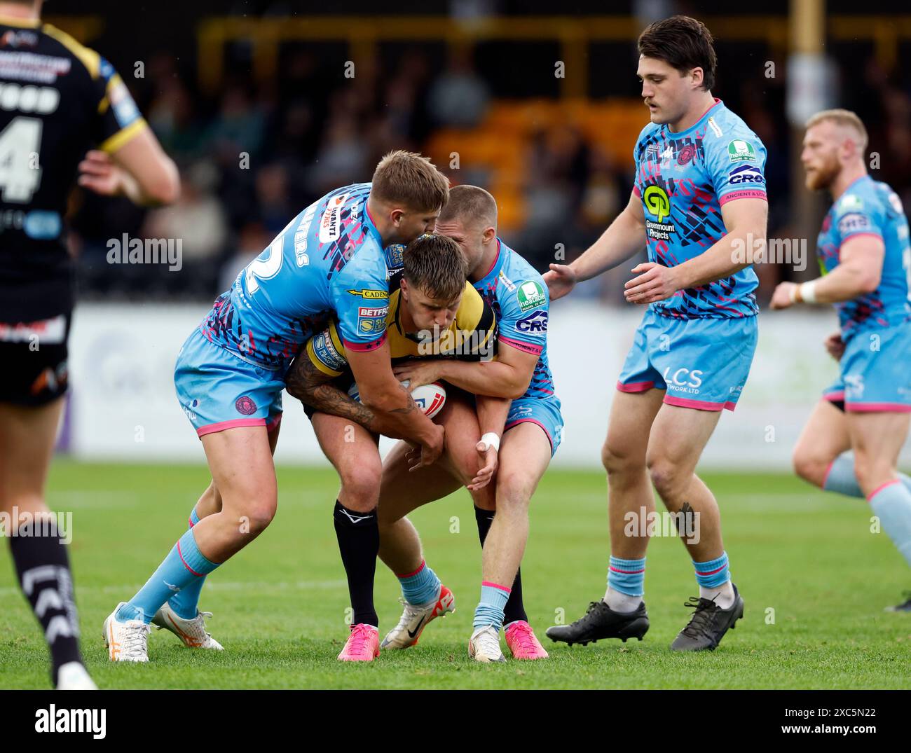 Castleford Tigers’ Alex Mellor is tackled by Wigan Warriors’ Sam ...