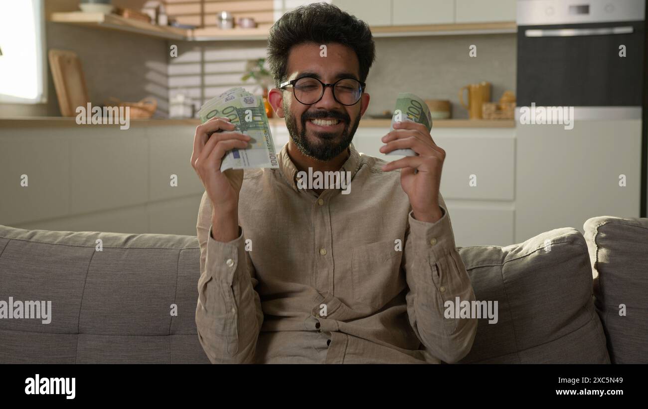 Happy rich man Arabian Indian wealthy businessman counting money cash ...