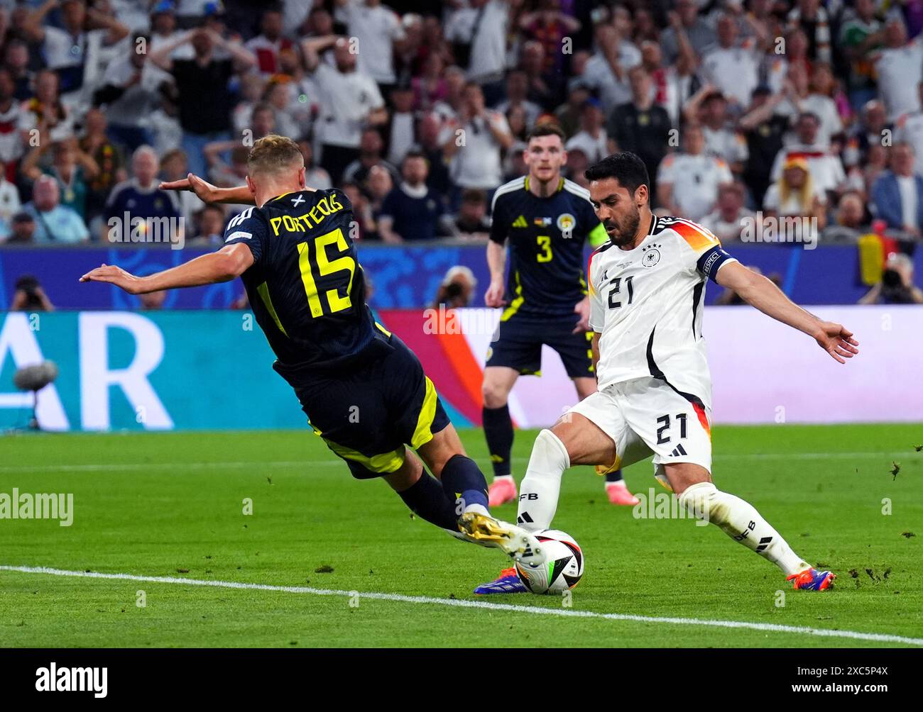 Scotland's Ryan Porteous (left) fouls Germany's Ilkay Gundogan ...