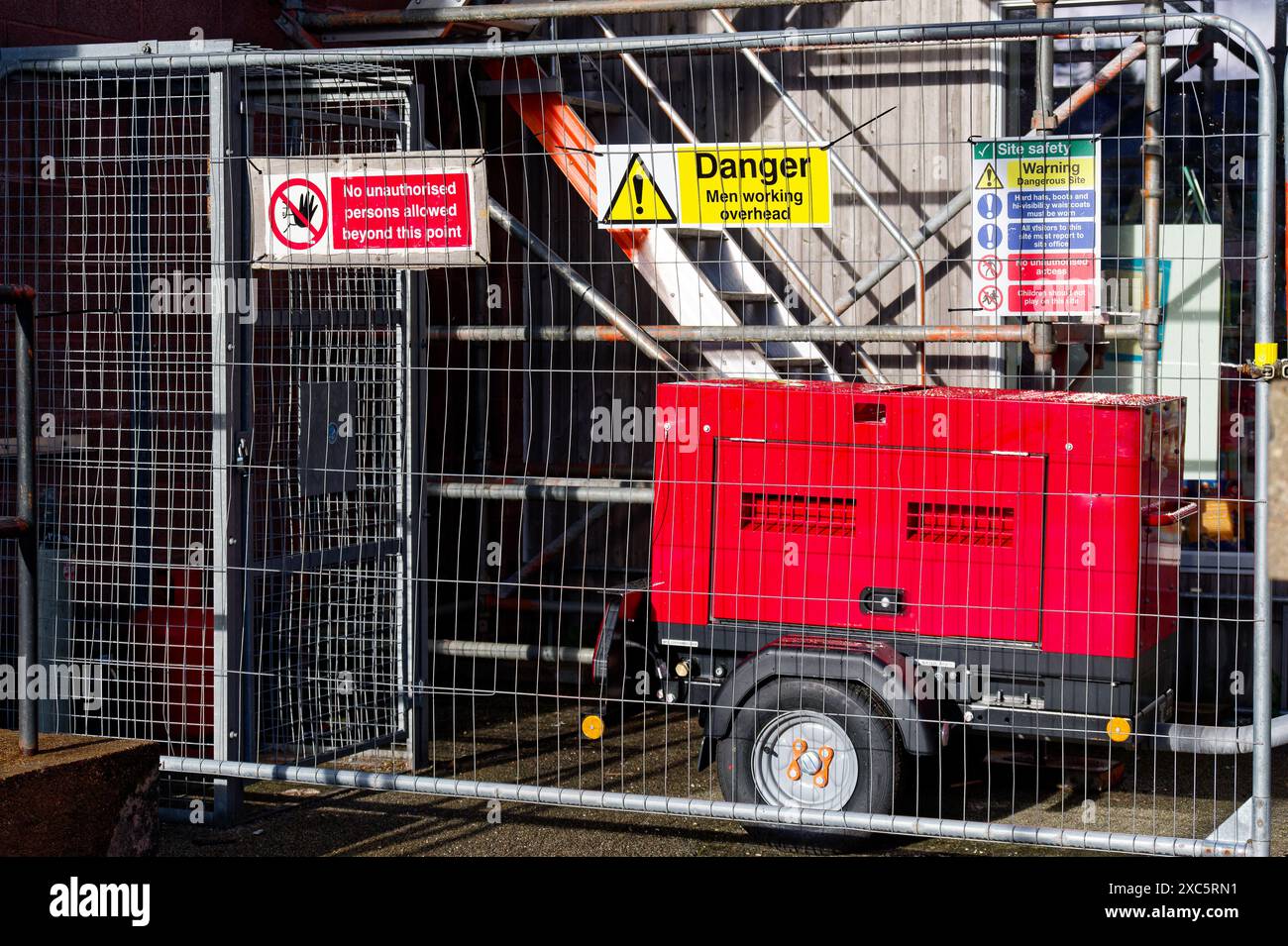 Construction site health and safety sign on fence Stock Photo - Alamy