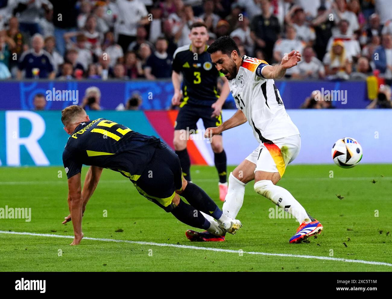 Scotland's Ryan Porteous (left) fouls Germany's Ilkay Gundogan ...