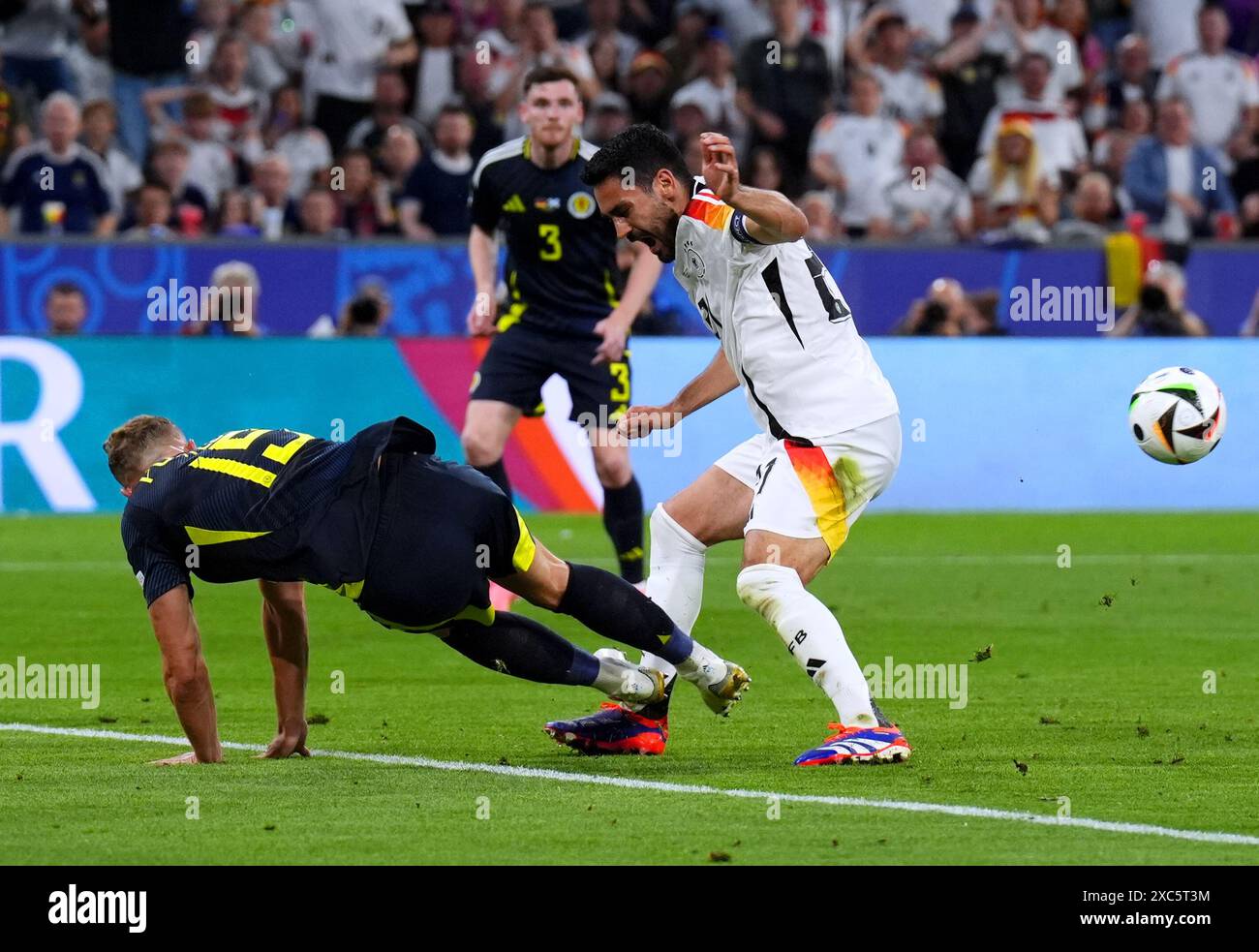 Scotland's Ryan Porteous (left) fouls Germany's Ilkay Gundogan ...