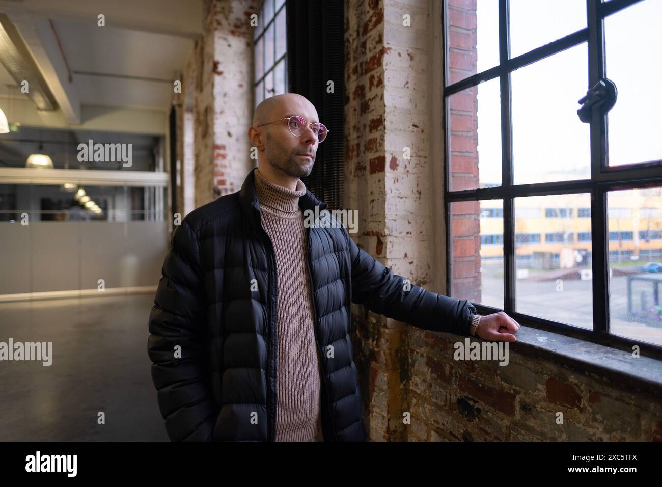 sad young man 35-year-old out window, emotional distress and life ...