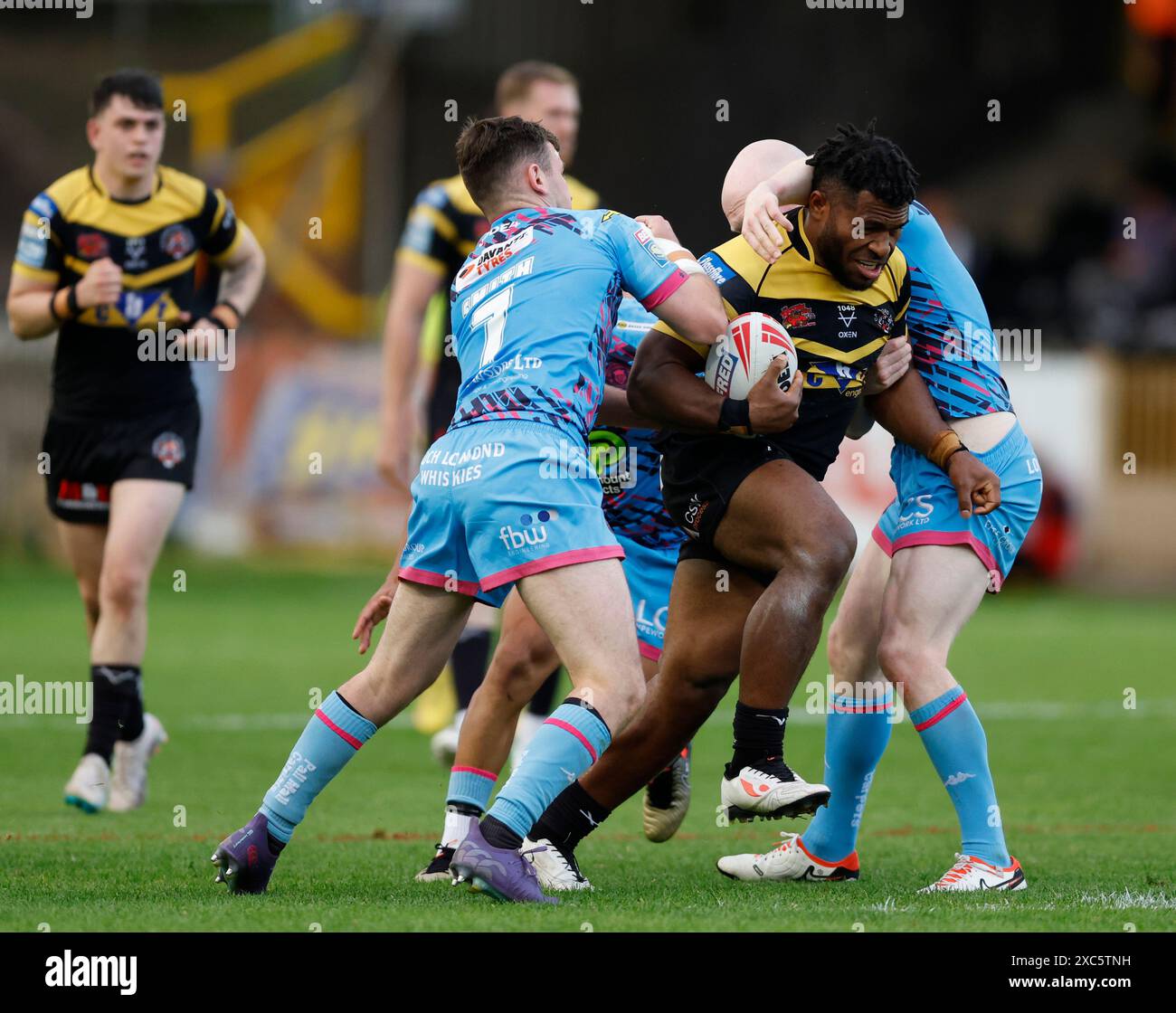 Castleford Tigers’ Sylvester Namo is tackled by Wigan Warriors’ Harry ...
