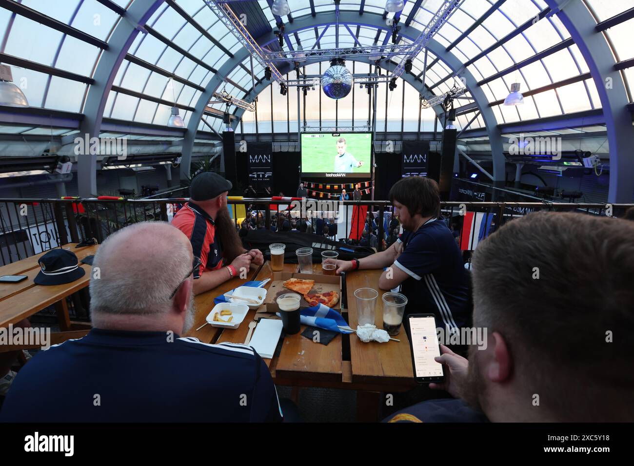 Scotland fans at the BAaD, Glasgow, watching the UEFA Euro 2024 Group A ...