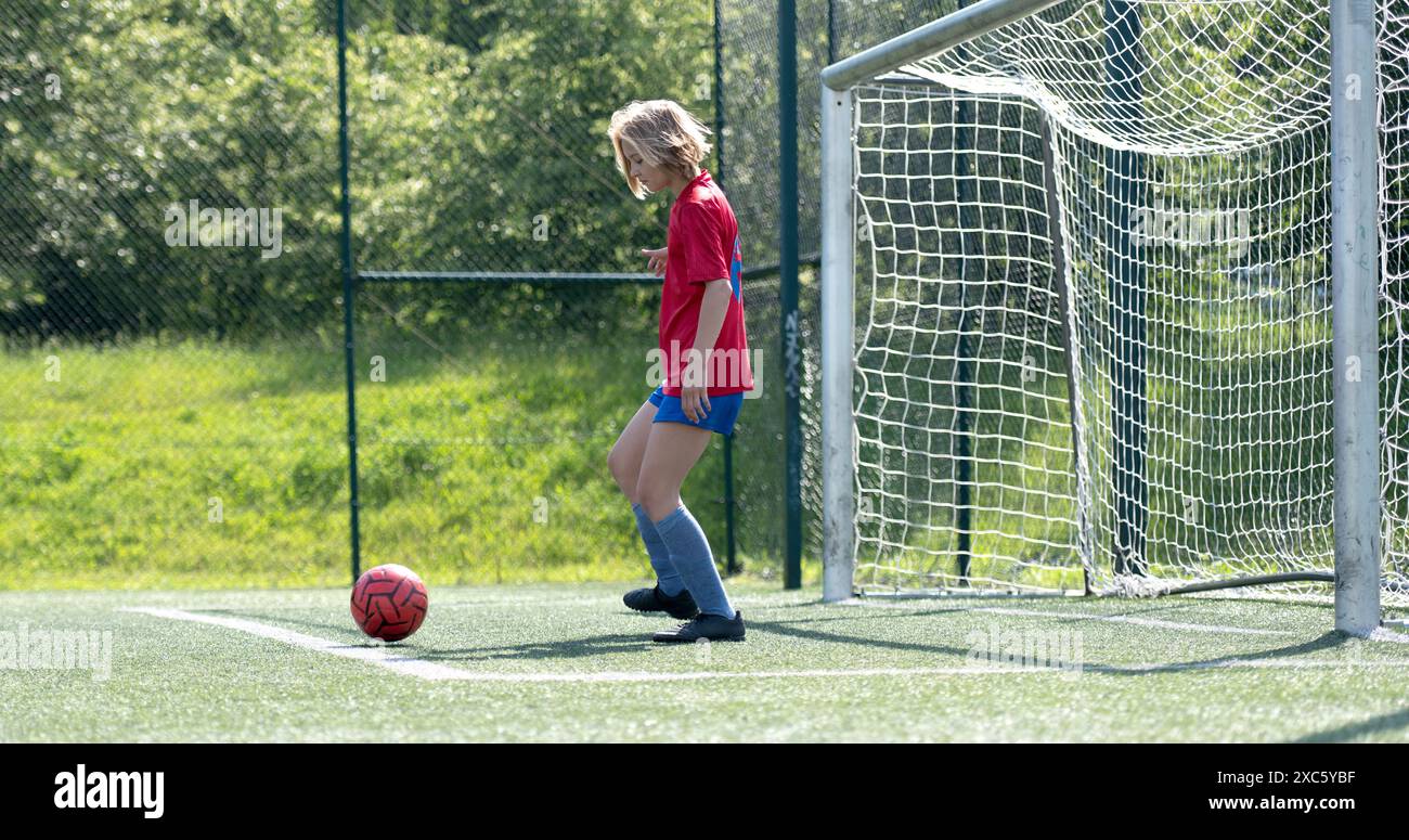 Girl Goalkeeper Tries To Catch Ball In Children'S Football Match Stock ...