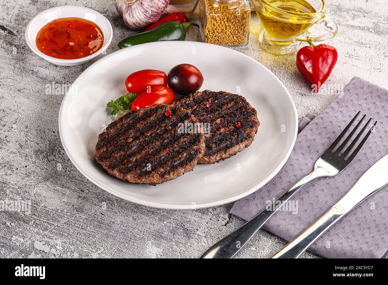 Grilled beef burger cutlet with sauce Stock Photo - Alamy