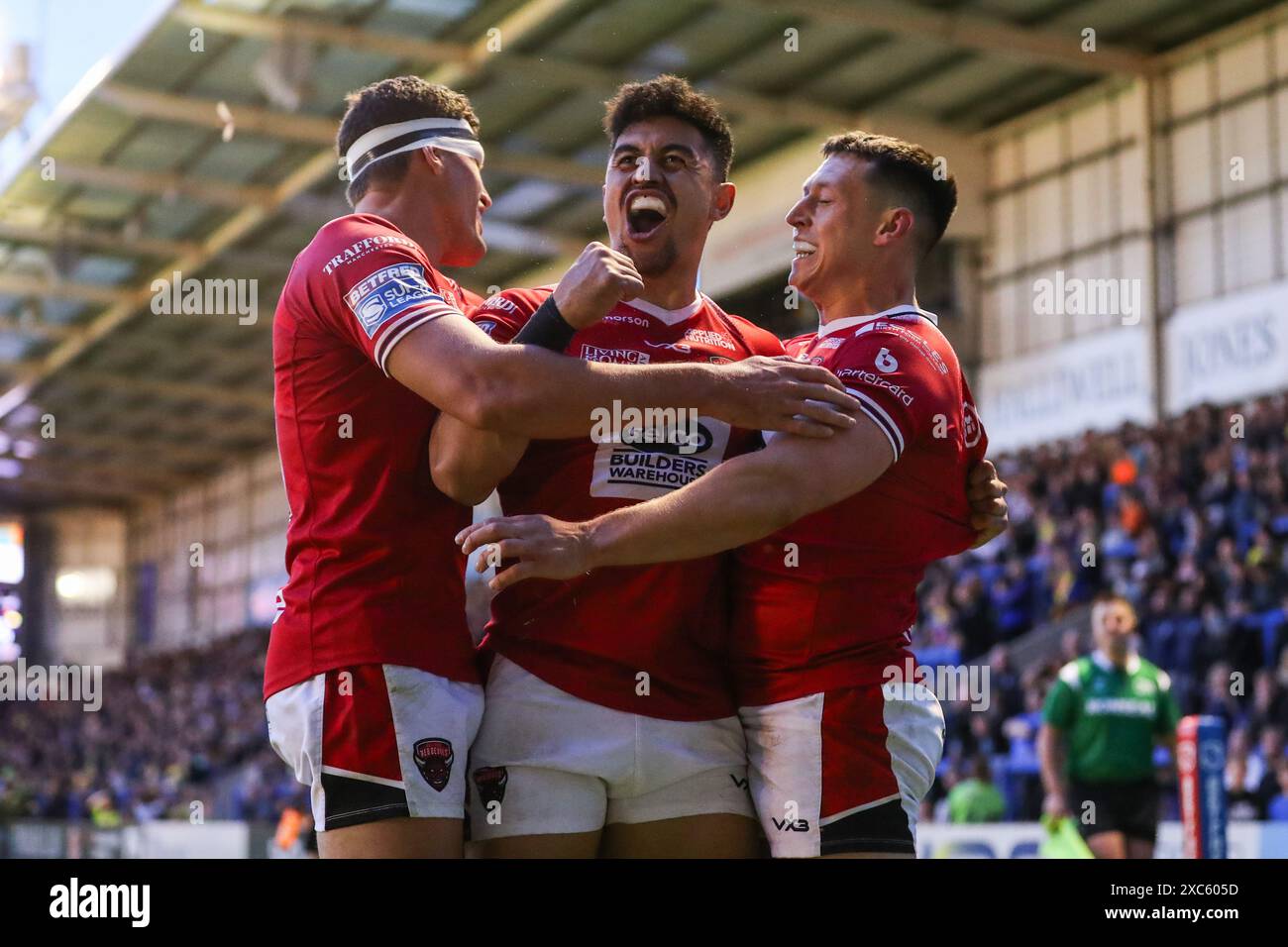 Deon Cross of Salford Red Devils celebrates his try to make it 8-23 ...