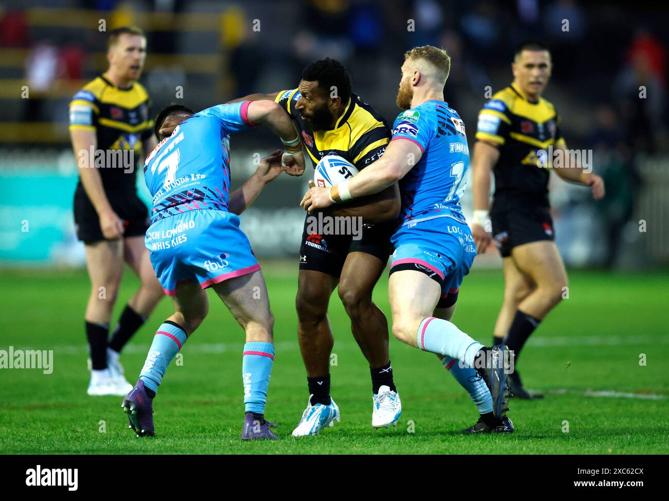 Castleford Tigers’ Nixon Putt is tackled by Wigan Warriors’ Harry Smith ...