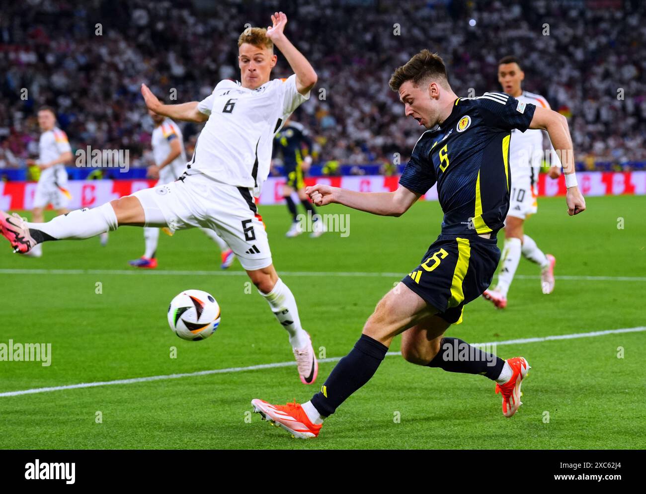 Germany's Joshua Kimmich (left) and Scotland's Kieran Tierney battle ...