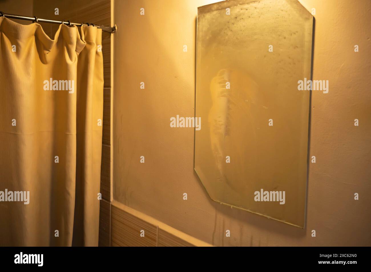 View of bathroom with steamy mirror. Bathroom with warm light Stock ...