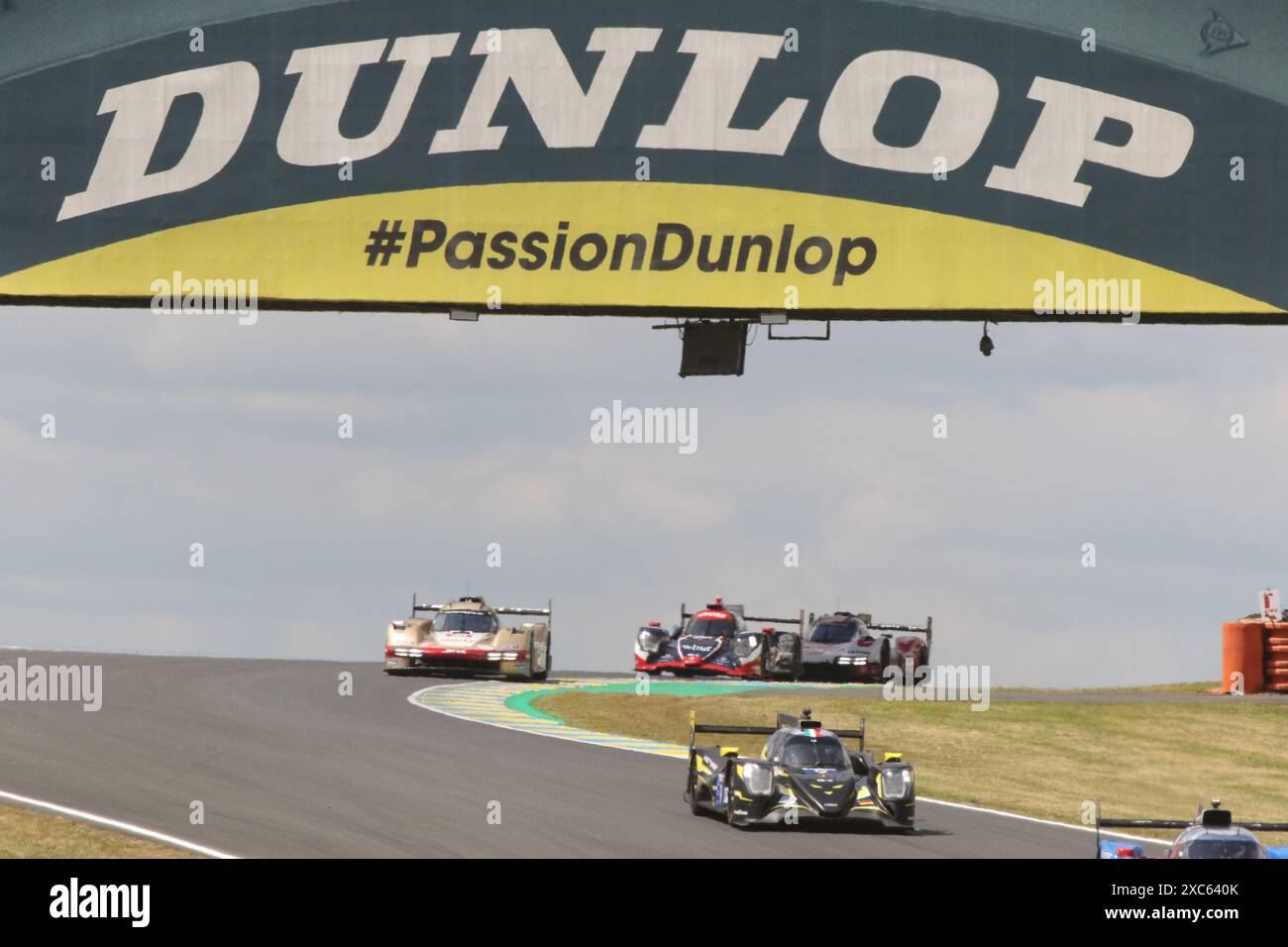 Le Mans June 2024 Car stream under the world famous Dunlop Bridge ...