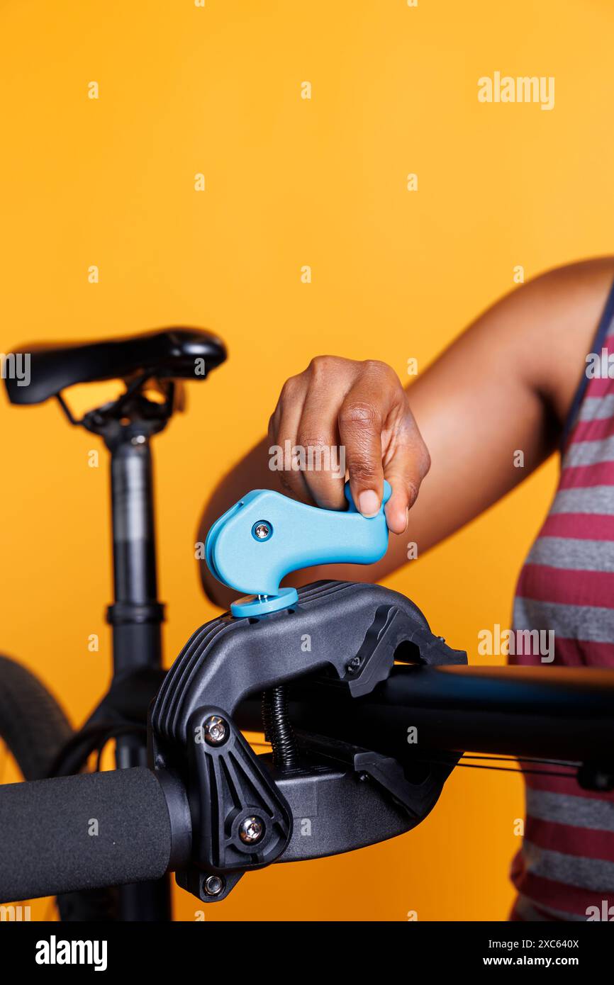 African american individual repairing a damaged bicycle by adjusting ...