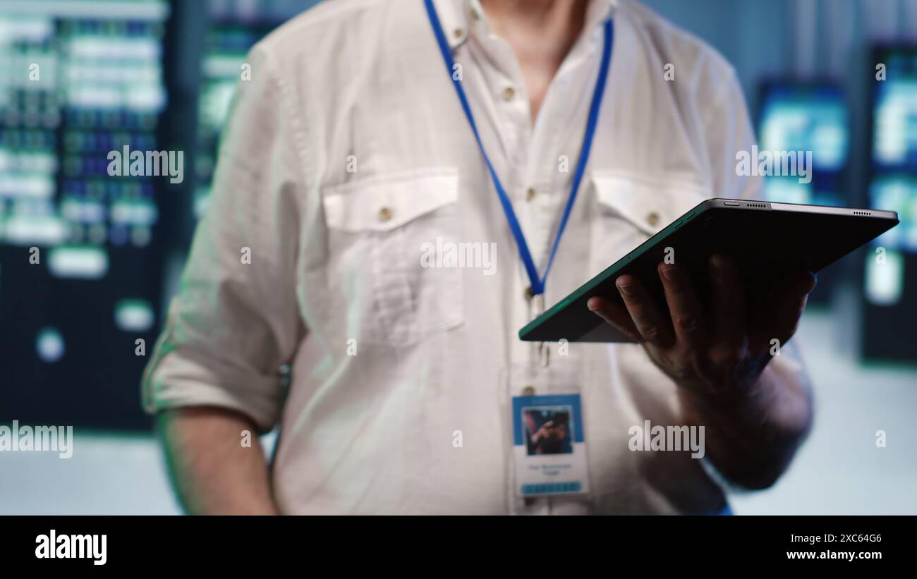 Old admin expertly managing data while navigating through industrial ...