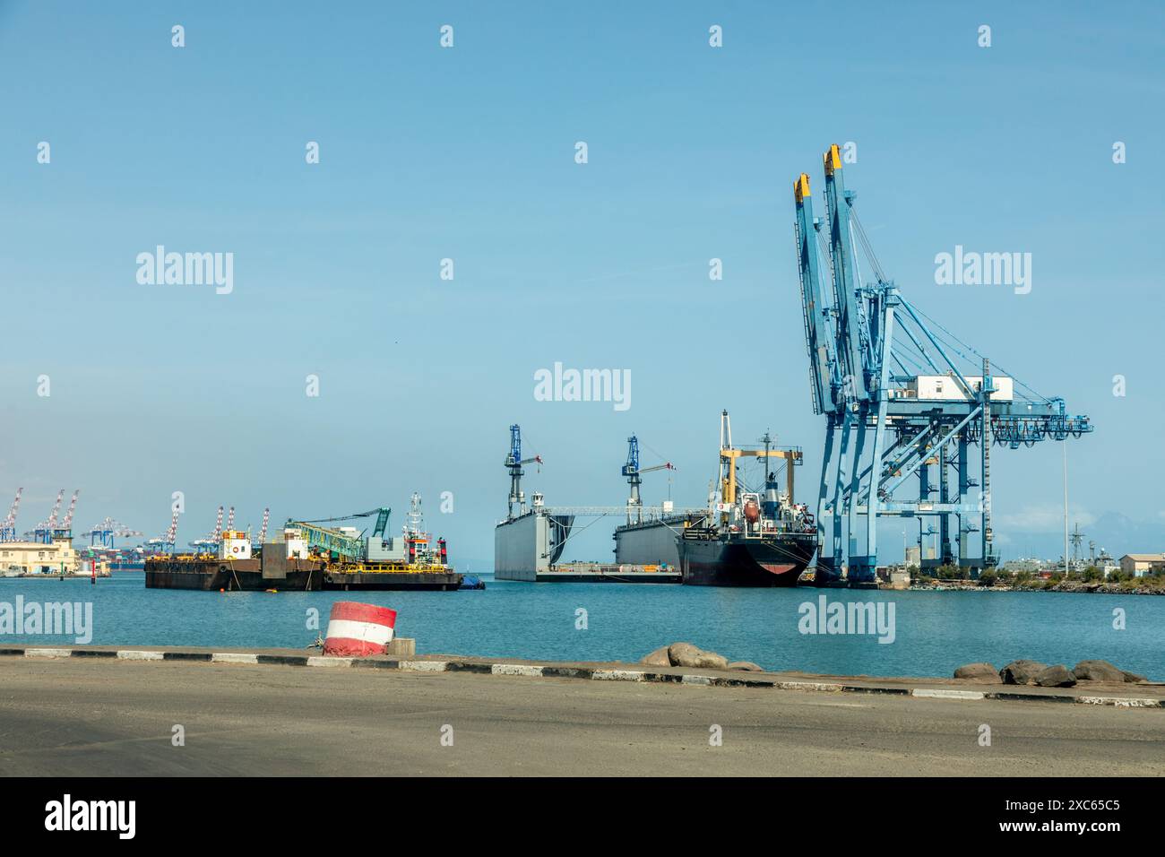 Djibouti city port cargo terminal with cranes, floating docks and ships ...