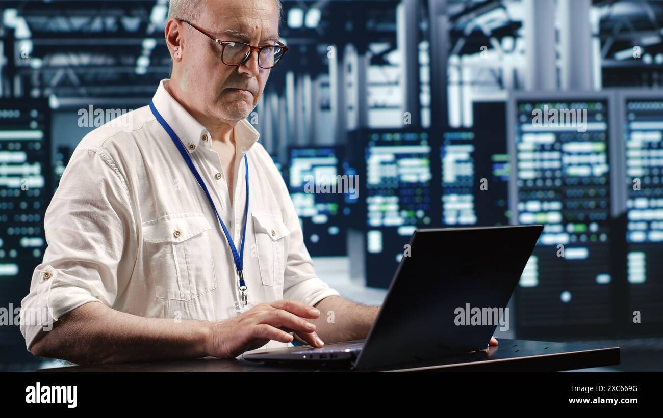 Licensed serviceman expertly managing data while navigating in industrial server room. Tech ...
