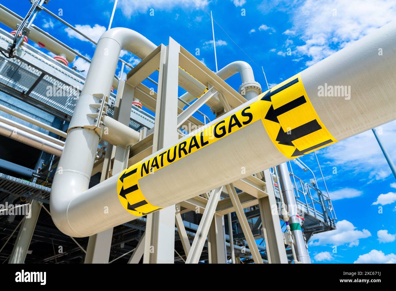 Natural gas pipeline with high pressure and direction sign at ...