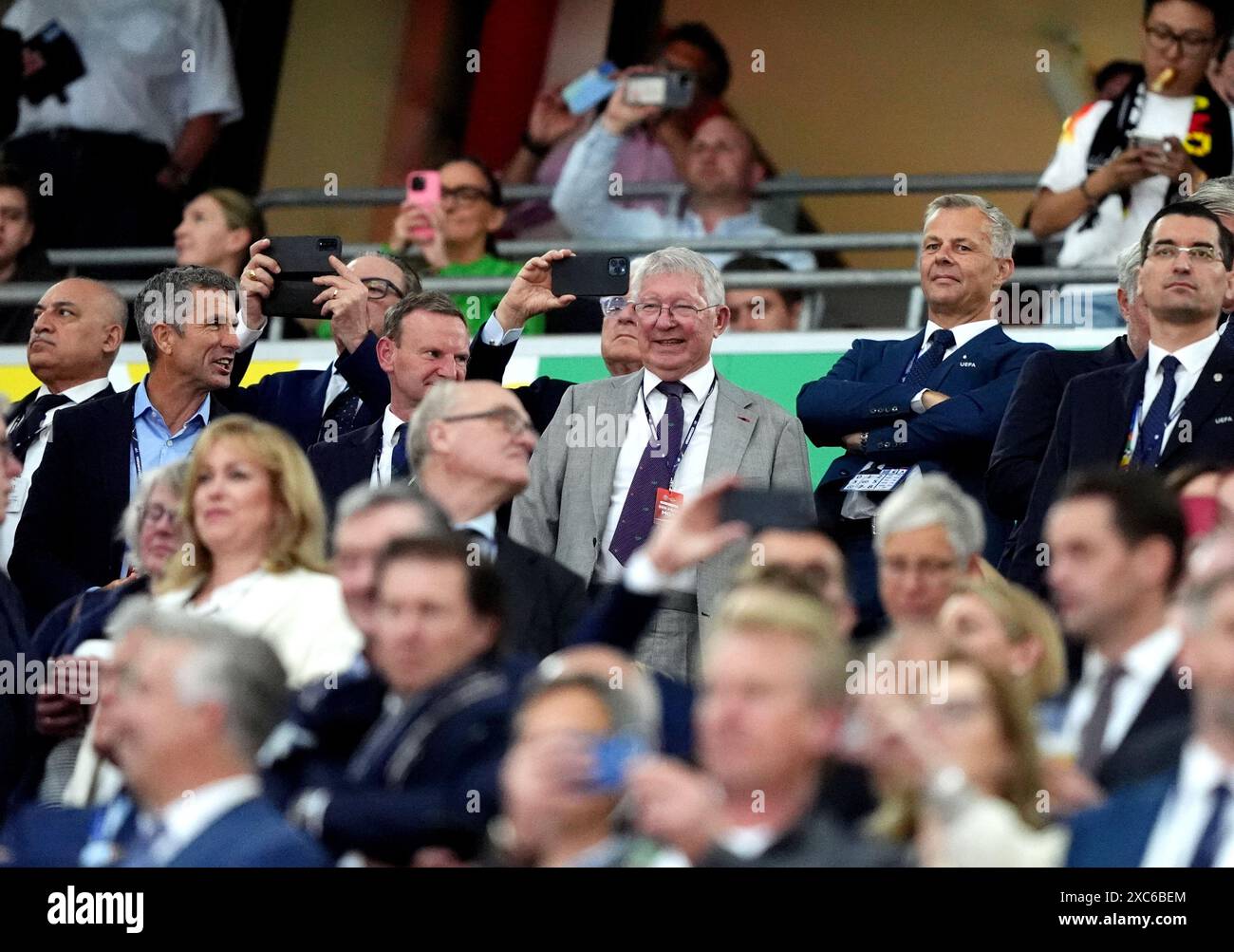 Sir Alex Ferguson (centre) in the stands ahead of the UEFA Euro 2024 ...