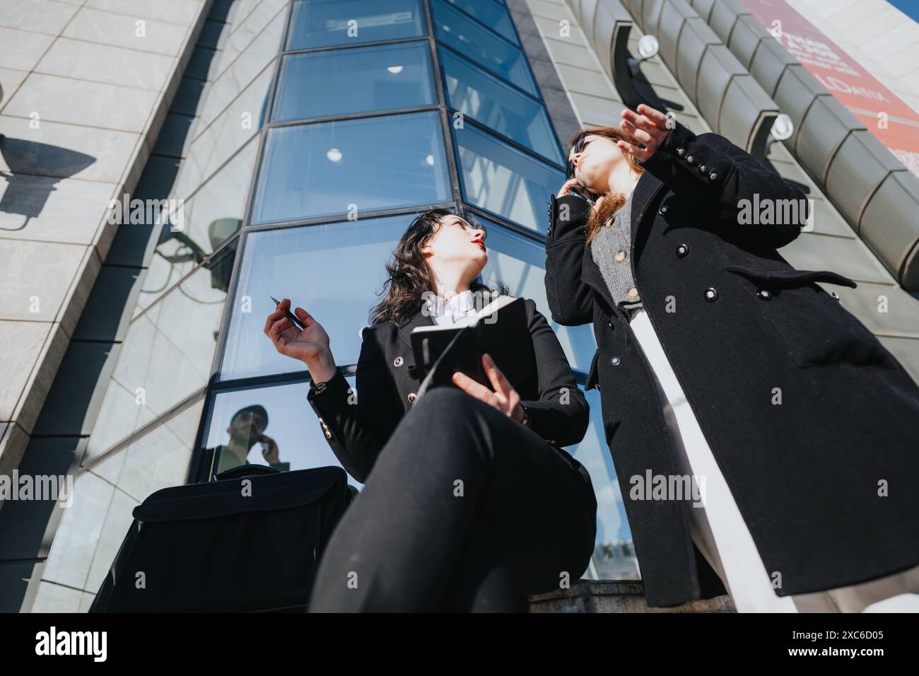 Young entrepreneurs engage in a creative brainstorming session outside ...