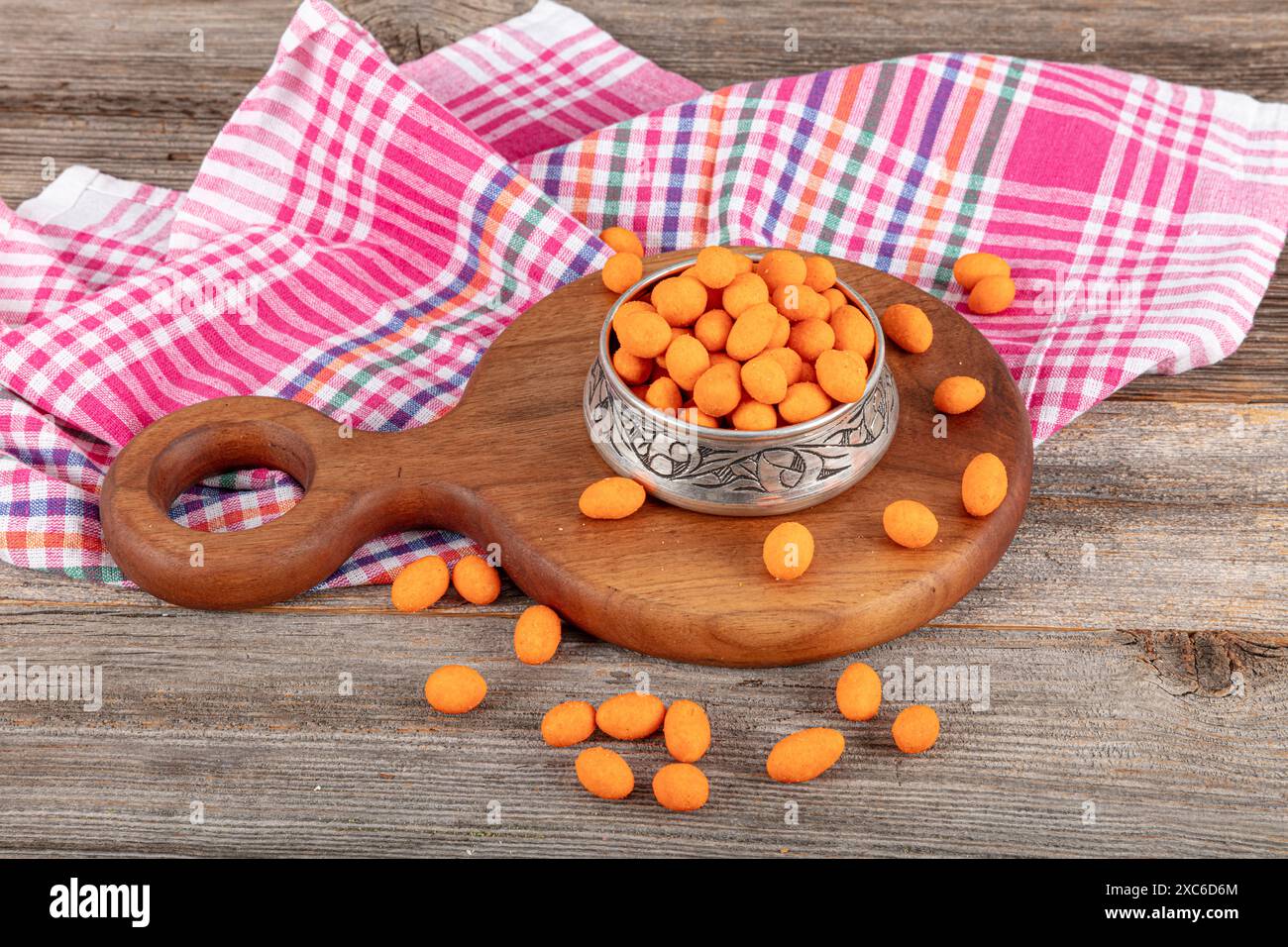Crispy coated peanuts background. Pile of yellow edible balls close up ...