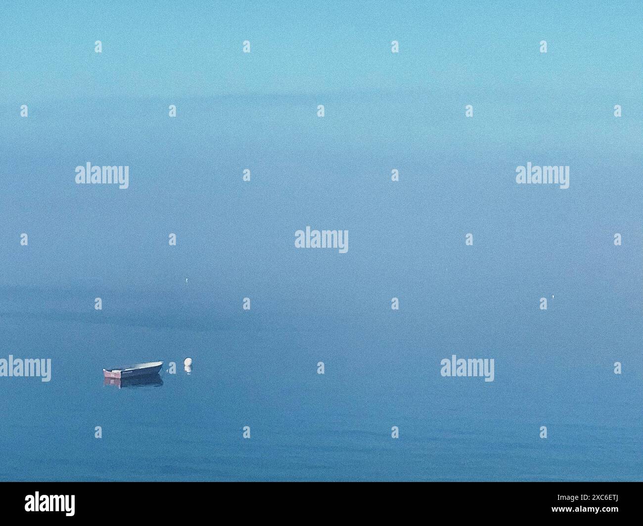 Moored rowboat at sea Stock Photo - Alamy