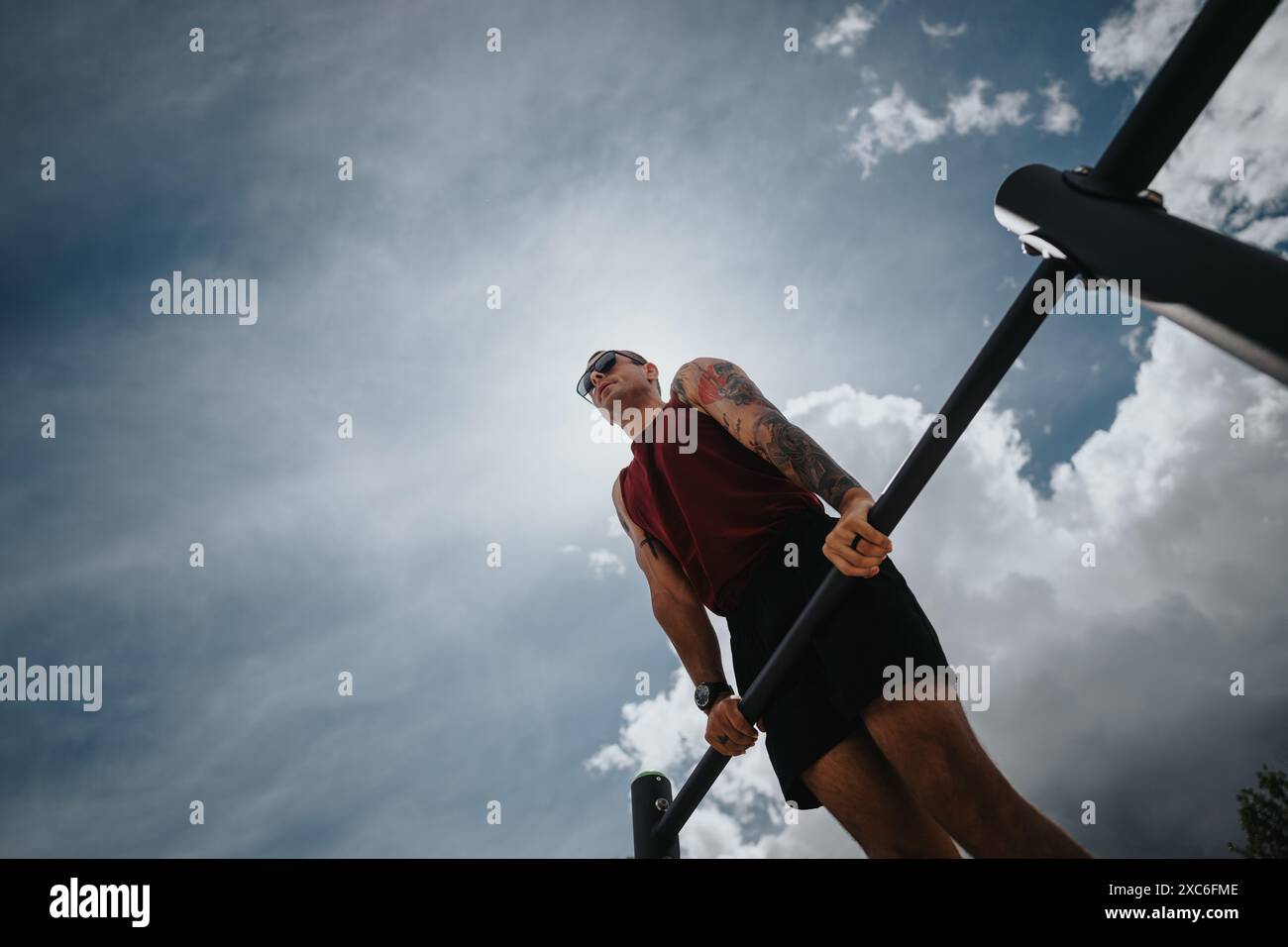 Athlete training on bars in the city hi-res stock photography and ...