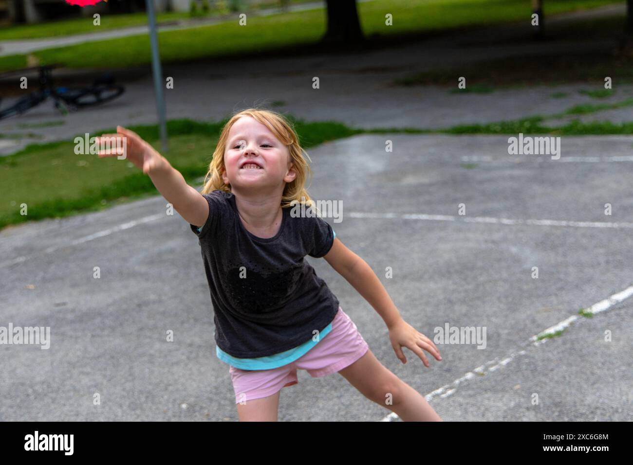 Young Girl Playing Catch on a Summer Day Stock Photo - Alamy