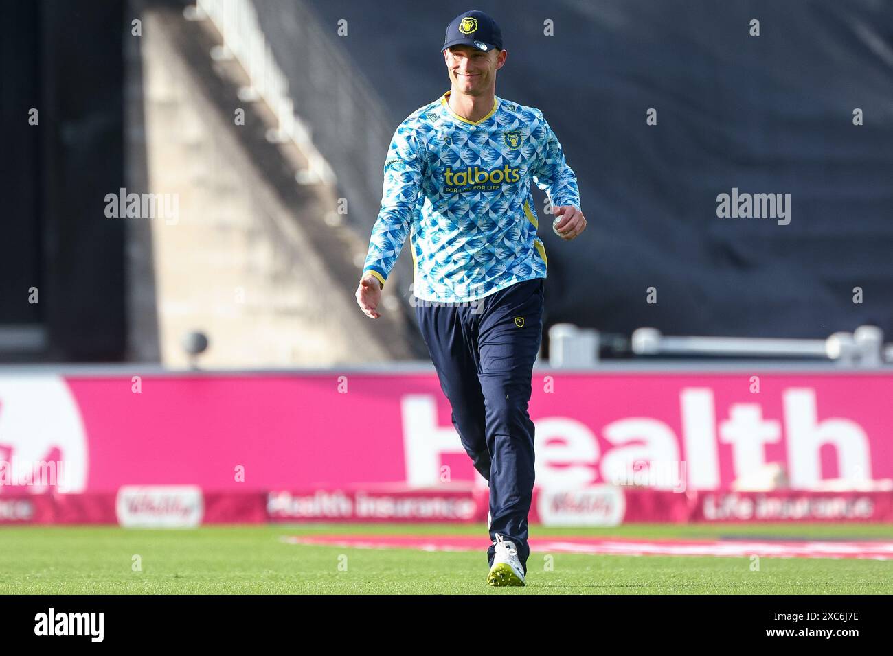 Chris Benjamin races to celebrate the dismissal of Joe Root taken in ...