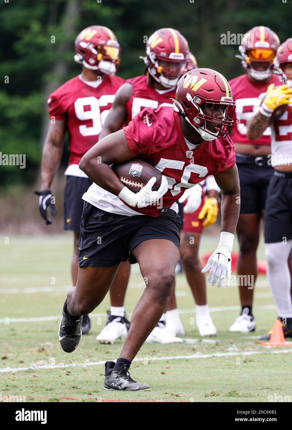 Washington Commanders defensive end Jalen Harris (56) performing drills ...