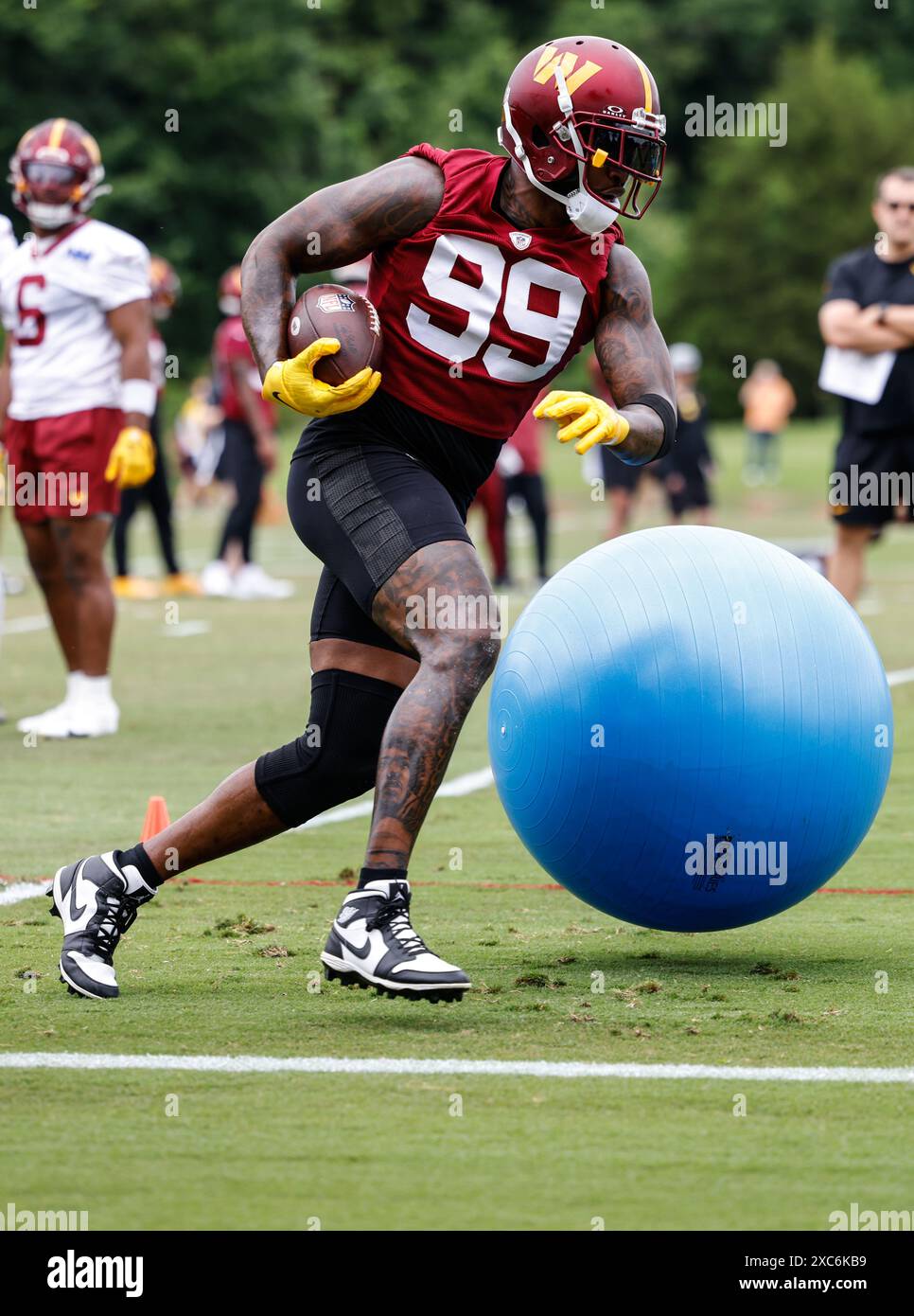 Washington Commanders defensive end Clelin Ferrell (99) performing ...