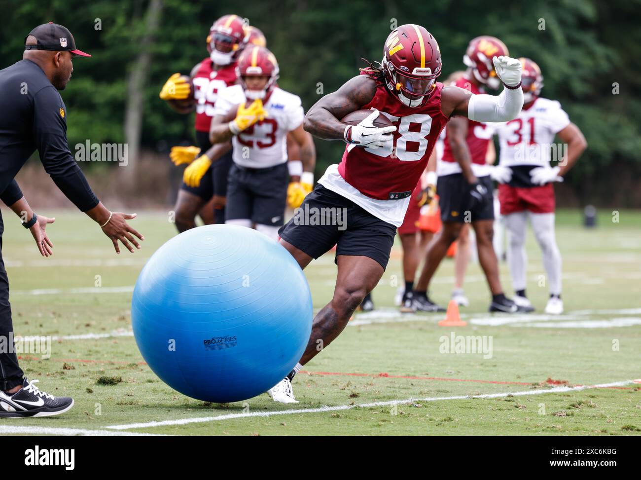 Washington Commanders linebacker Jordan Magee (58) performing drills at ...