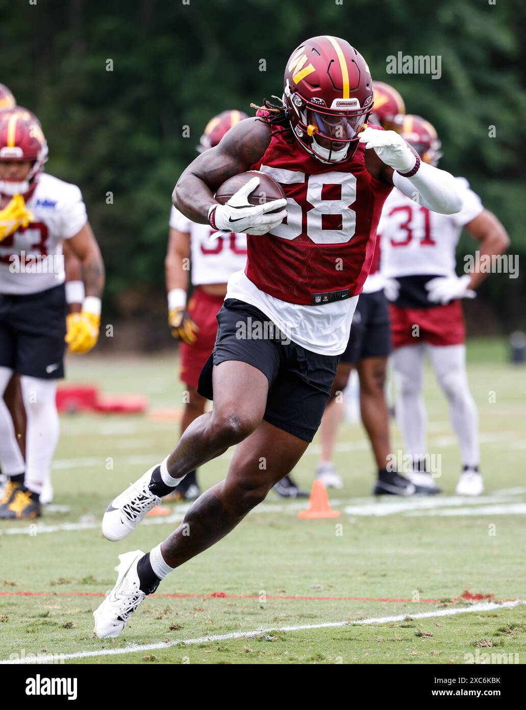 Washington Commanders linebacker Jordan Magee (58) performing drills at ...